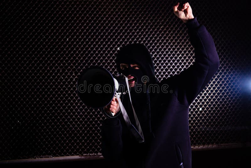 Angry Masked Man is Shouting into the Megaphone Stock Image - Image of ...