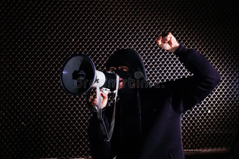 Angry Masked Man is Shouting into the Megaphone Stock Image - Image of ...