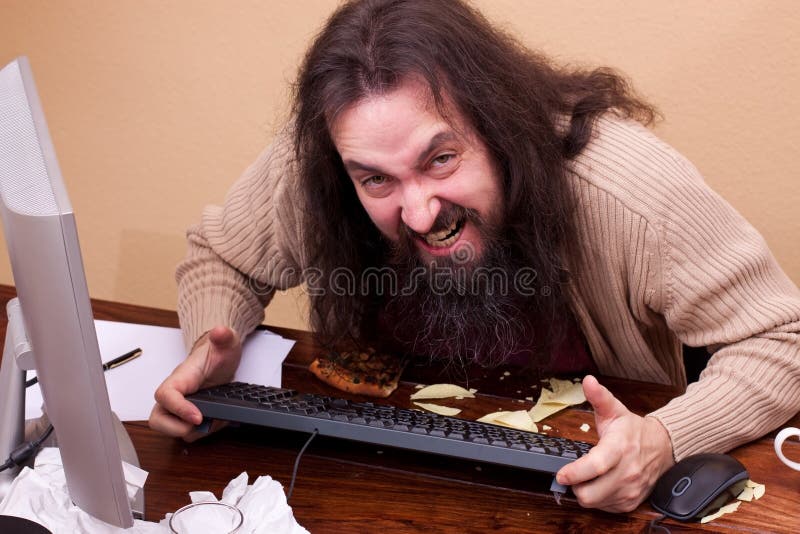 Angry Nerd at a Desk Looking at Viewer Stock Image - Image of male ...