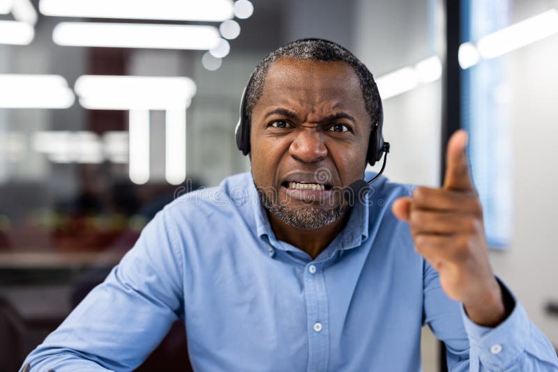 Angry Office Worker Wearing Headset Pointing and Talking Aggressively ...