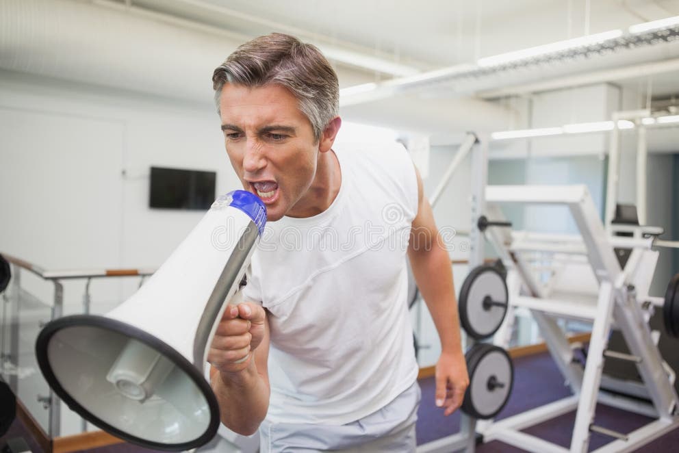 Angry Personal Trainer Shouting through Megaphone Stock Image - Image ...