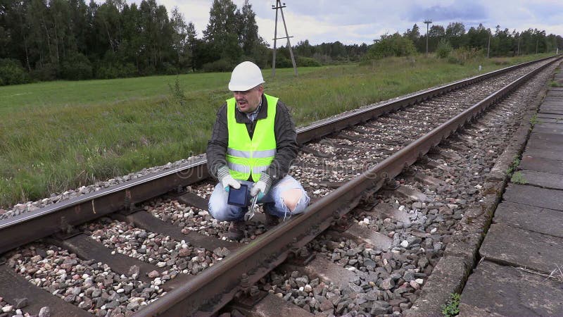 Railroad Worker Repairing a Broken Track. Working Metal. Worker Cutting ...