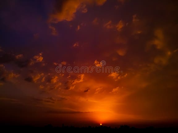 Angry Red Sunset Scene with Cumulus Clouds Stock Image - Image of ...