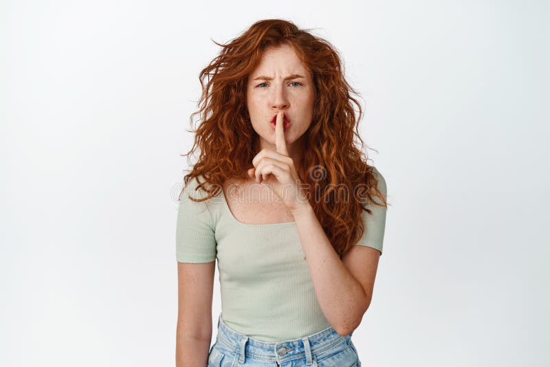 Angry Redhead Teen Girl Hush Frowning Upset And Shushing Tell To Be