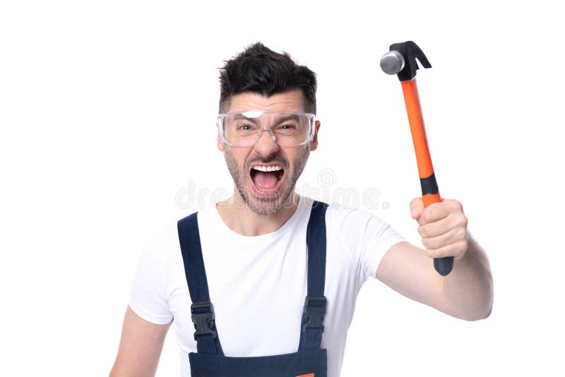 Angry Repairman Using Hammer Tool. Repairman with Hammer in Studio ...