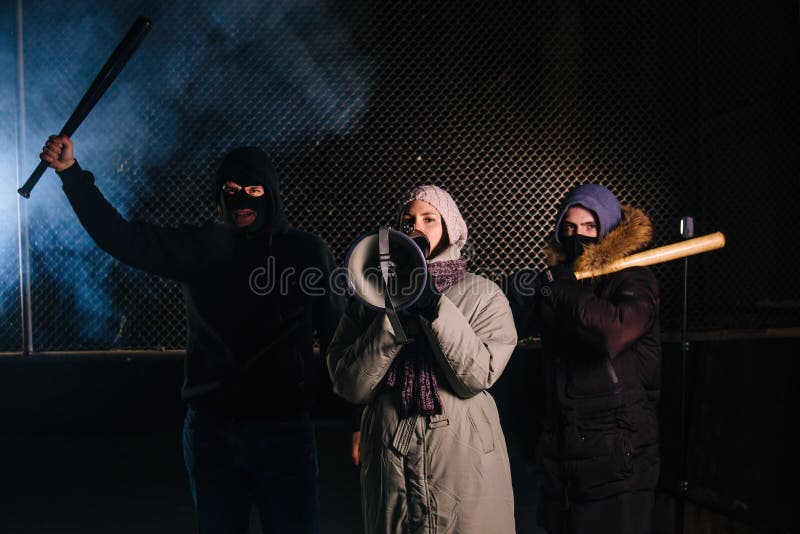 Angry Riots with a Bat and Megaphone, Revolt Concept Stock Photo ...