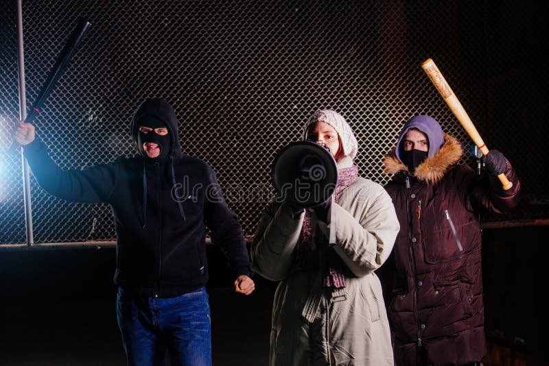 Angry Riots with a Bat and Megaphone, Revolt Concept Stock Photo ...
