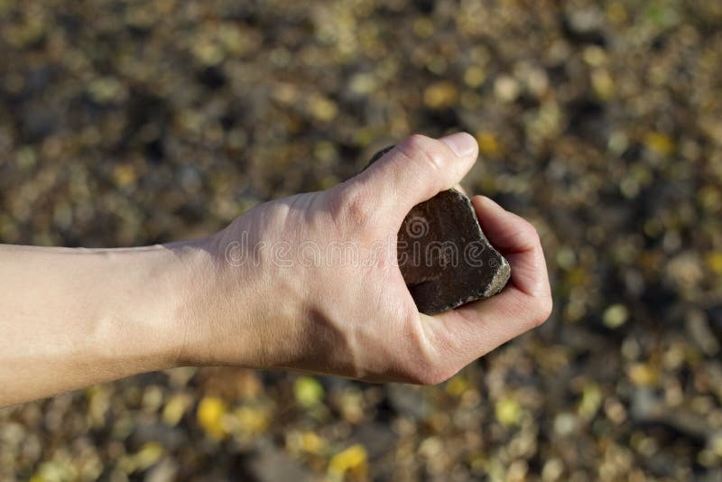 Hand Holding Tight On A Rock Stock Photo - Image of holding, white: 9032284
