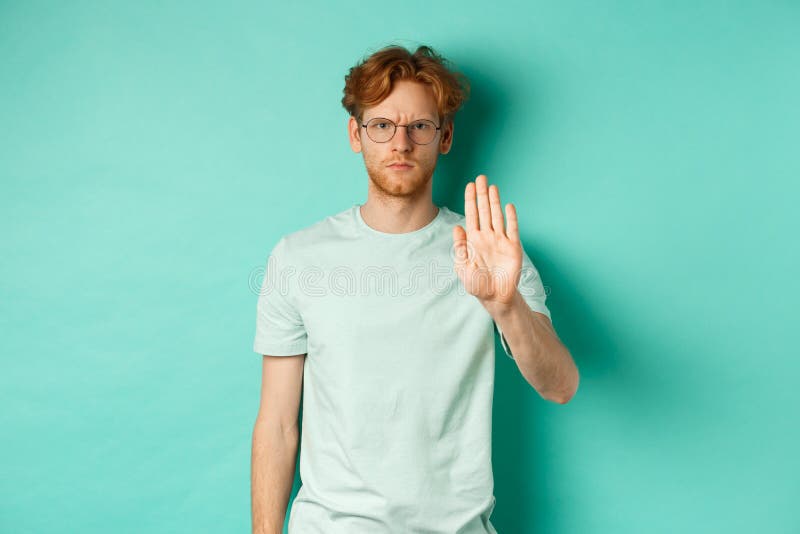 Reluctant Redhead Man In Glasses Raising Hands In Refusal Gesture Step
