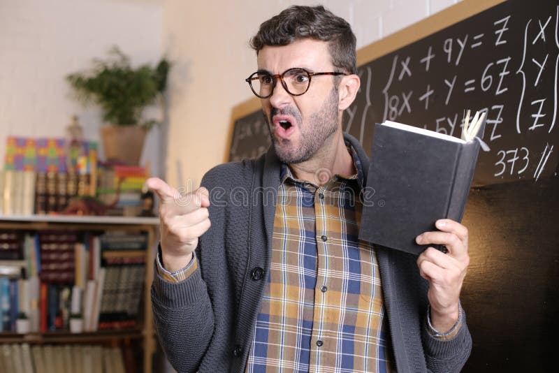 Angry Teacher Pointing with Finger in Classroom Stock Image - Image of ...