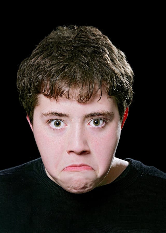 Angry teen face over black stock photo. Image of eyes - 4891378