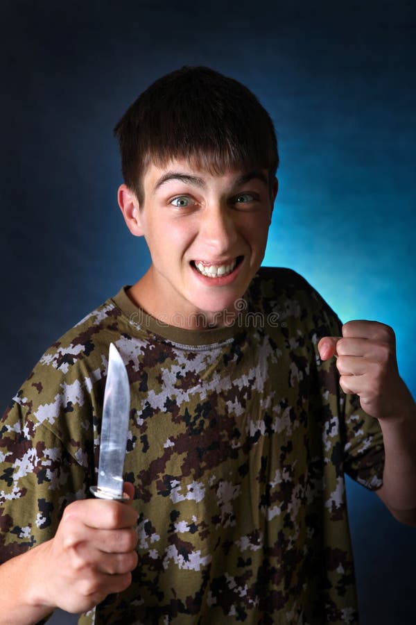 Angry Teenager with Knife stock image. Image of nervous - 34535315