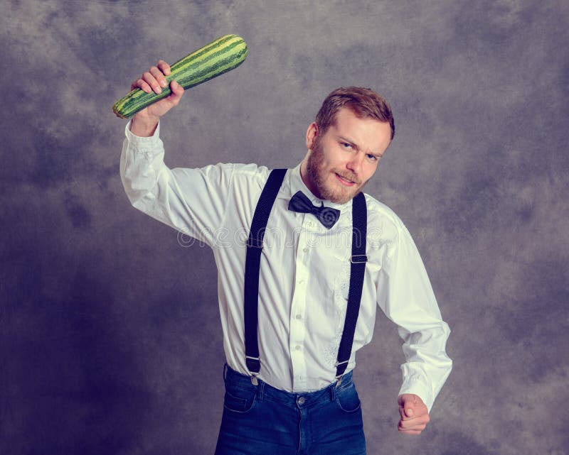 Angry Vegetarian Minatory with Zucchini Cudgel Stock Image - Image of ...