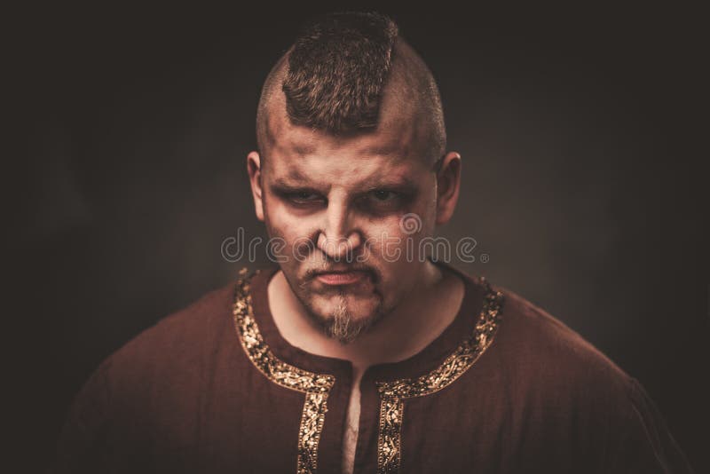 Angry Viking in a Traditional Warrior Clothes, Posing on a Dark ...