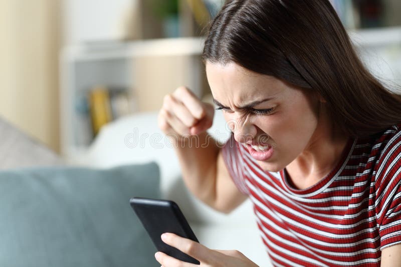 Angry Woman Checking Smart Phone at Home Stock Photo - Image of adult ...