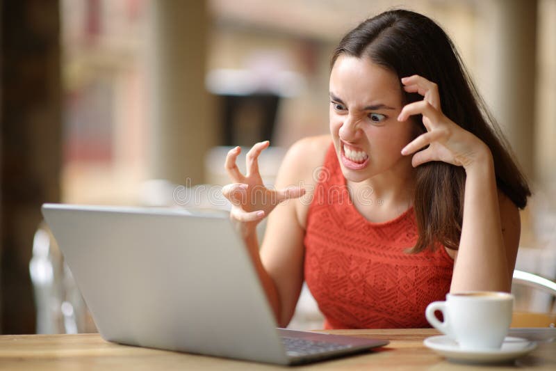 Angry Woman Having Problems with a Laptop in a Bar Stock Image - Image ...