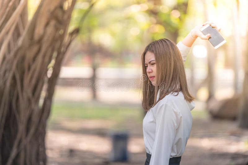 Man Throwing Phone in Garbage Bin Stock Photo - Image of person ...