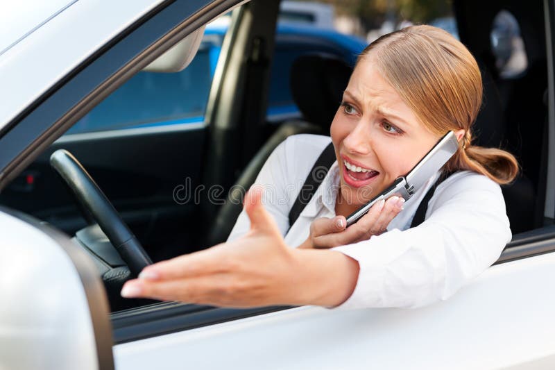 Angry woman in traffic jam stock photo. Image of cellphone - 27020602