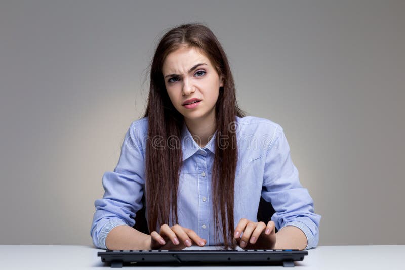 Angry woman using keyboard stock photo. Image of device - 72414260