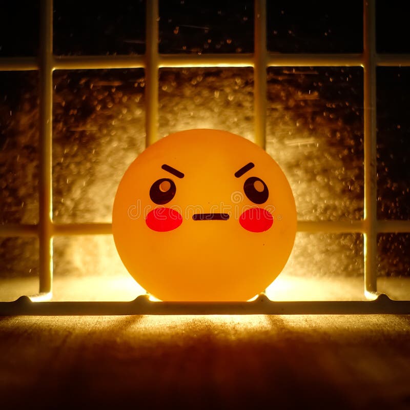 Angry Yellow Emoticon in Yellow Light and Prison Stock Photo - Image of ...