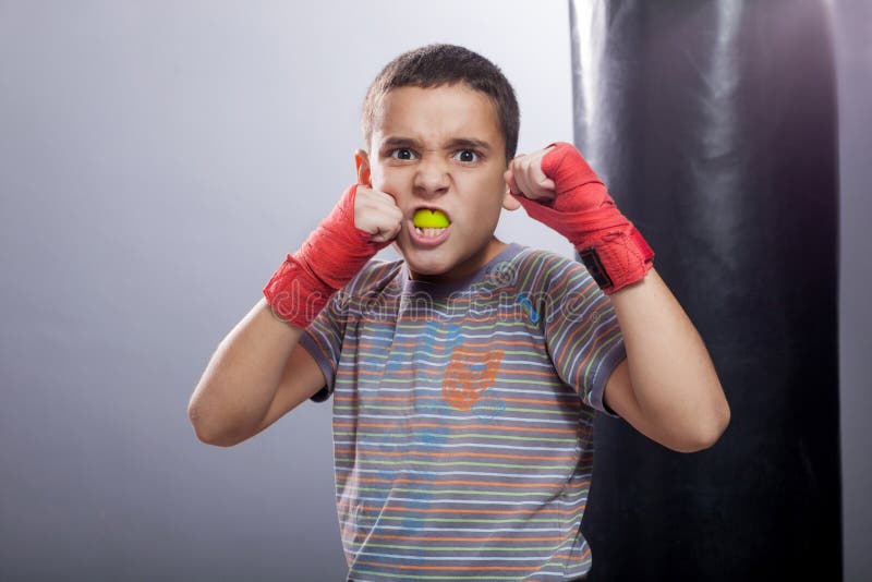 Angry Young Child Boxing in Bag Stock Photo - Image of athlete, boxing ...