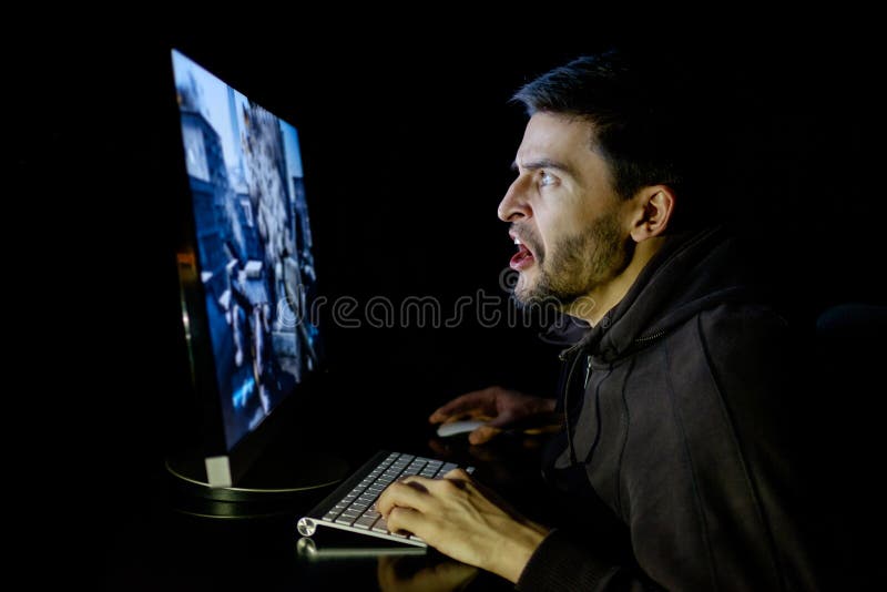 Angry Young Gamer Playing Videogame Stock Photo - Image of darkness ...