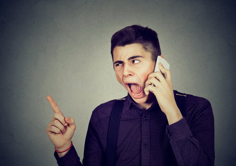 Angry Young Man Screaming on Mobile Phone Stock Photo - Image of ...