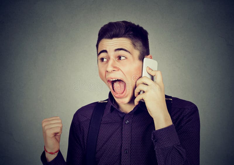 Angry Young Man Screaming on Mobile Phone Stock Photo - Image of ...