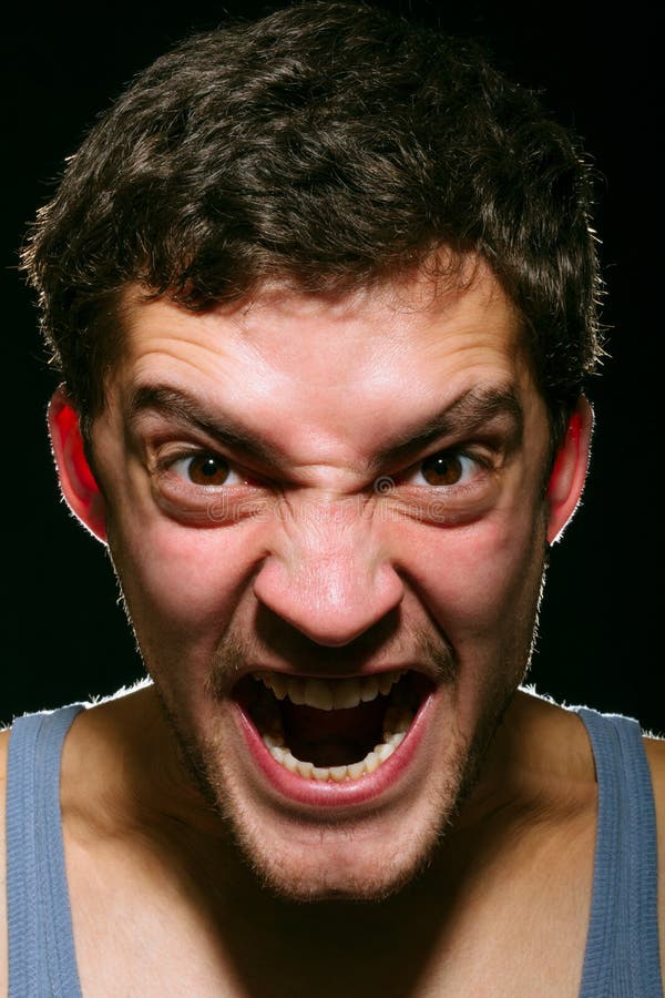 Angry young man shouting. stock photo. Image of mouth - 105306244