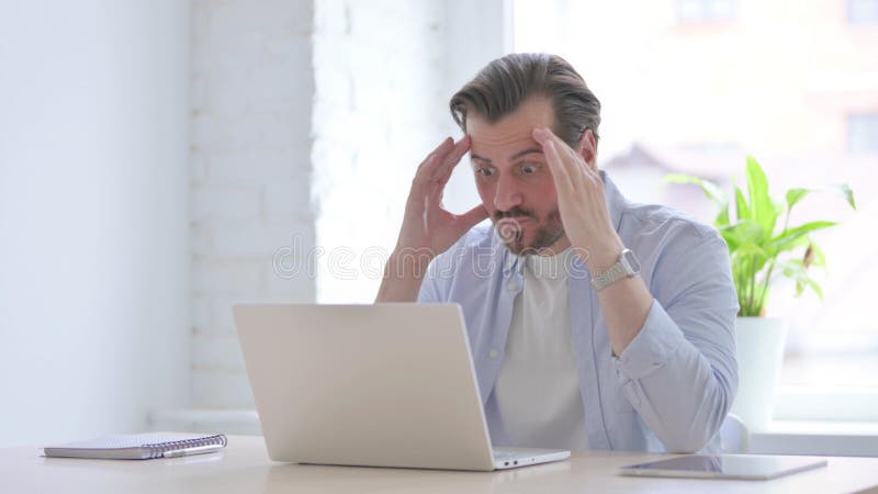 Angry Young Man Working on Laptop in Office Stock Image - Image of ...