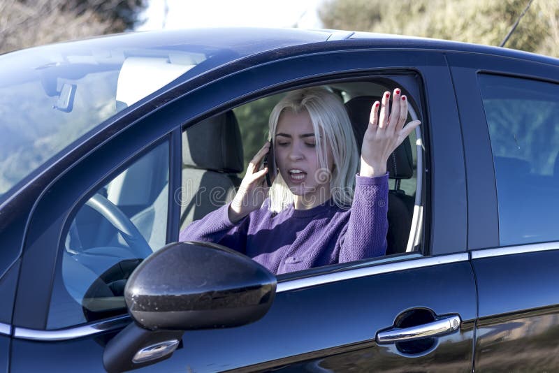 Angry Young Woman Driver Talking by Phone Stock Photo - Image of ...