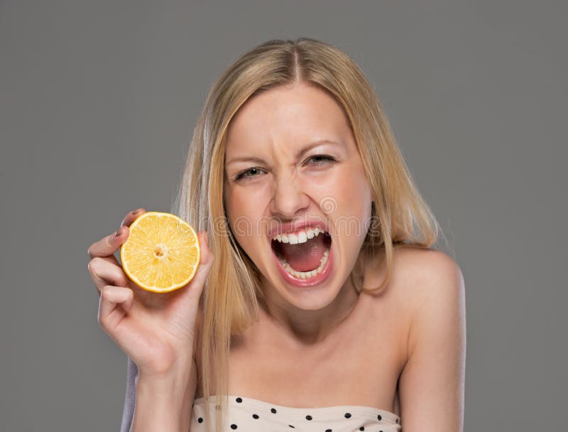 Angry Young Woman Showing Lemon Stock Image - Image of female, purity ...