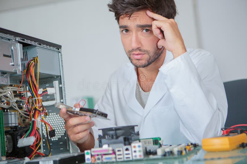Confused Computer Repair Man Stock Image - Image of professional ...