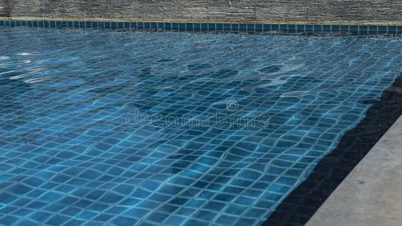 An Angular Fragment of a Swimming Pool. the Blue Tiled Bottom is ...