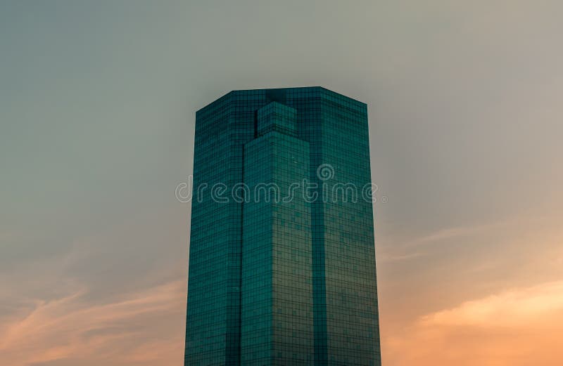 Angular Geometric Mirror Cladding On A Modern Building With Repeating Structure And Reflected