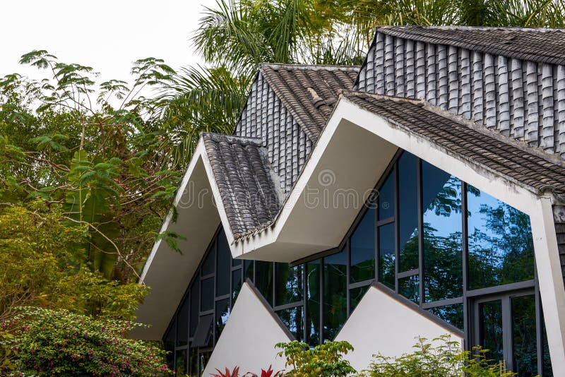 An Angular Modern Building in a Forest Stock Photo - Image of property ...