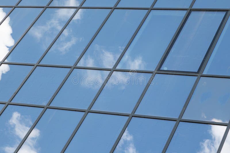 Angular View of Modern Glass Building with Sky Reflection on Windows ...