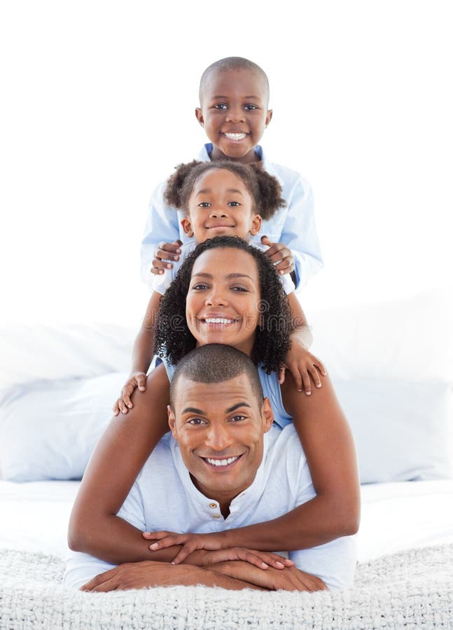 Animated Family Having Fun Lying Down on Bed Stock Image - Image of ...