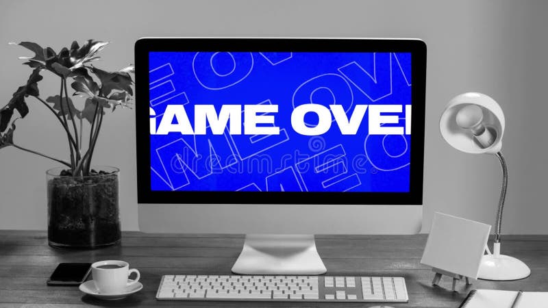 Animation of Multiple Game Over White Text Over Computer Screen on Desk ...