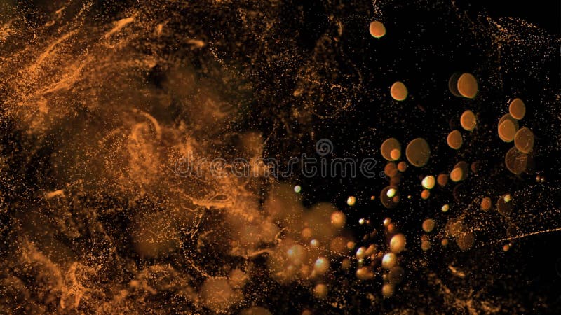 Animation of Orange Particle Cloud and Light Moving on Black Background ...