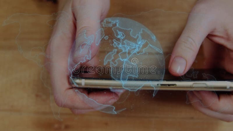 Animation of Spinning Globe Over Close of Hands Using Smartphone Stock ...