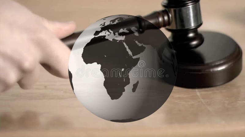 Animation of Spinning Globe Over Hand Using Gavel Stock Footage - Video ...
