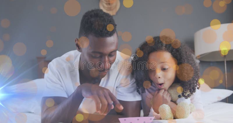 Animation of Spots Over African American Father with Daughter Smiling ... Animation of Spots Over African American Father with Daughter Smiling ...