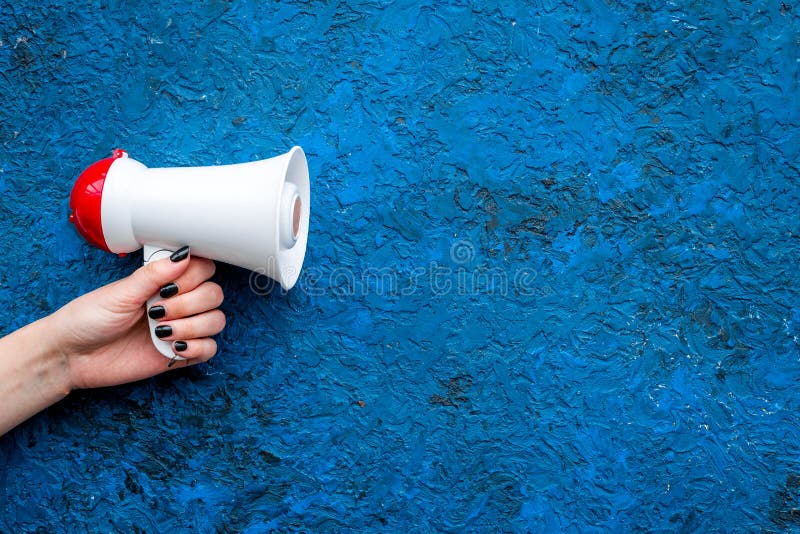 Announcement Concept. Megaphone in Hand on Blue Background Top View ...