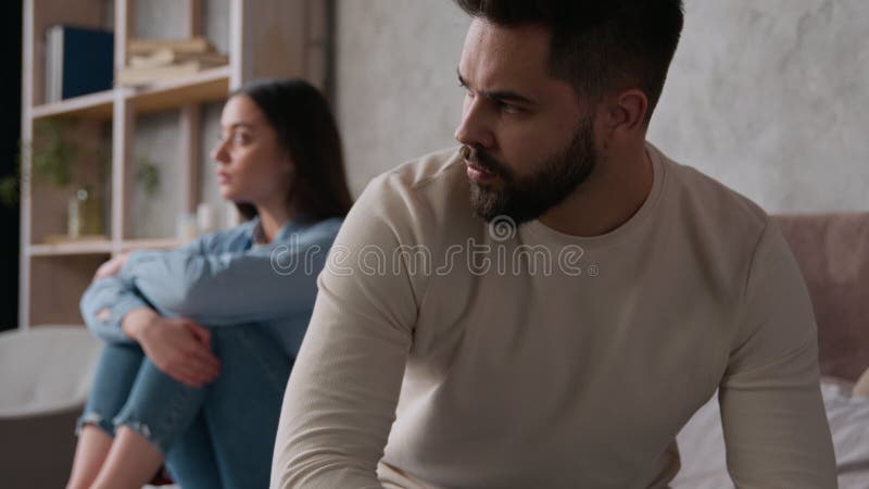 Annoyed Caucasian Husband Sit Apart On Bed With Offended Wife Keep