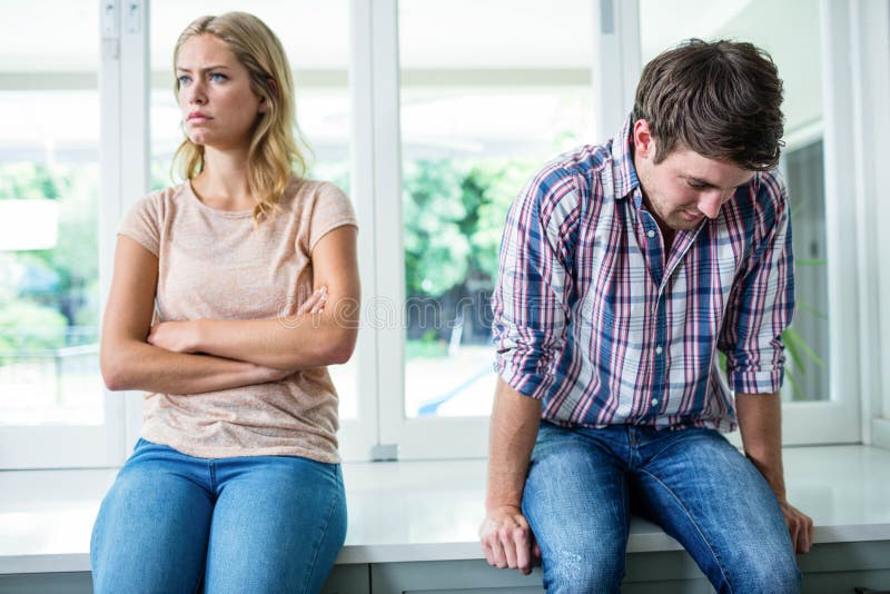 Man Ignoring Bored Woman while Talking on Mobile Phone Stock Photo ...