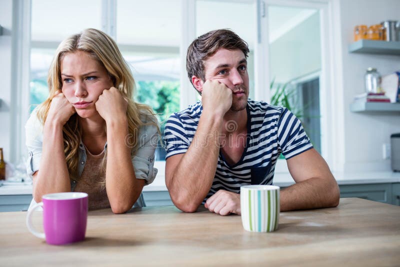 Couple Ignoring Each Other Sitting Back To Back on Bed Stock Image ...