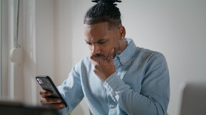 Annoyed Guy Using Mobile Phone at Flat. Irritated Man Looking ...