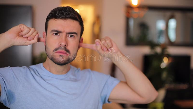Annoyed Man Covering His Ears Stock Footage - Video of manipulation, noisy: 371623156