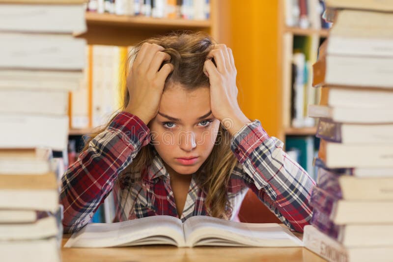 Annoyed Pretty Student Studying between Piles of Books Stock Image ...